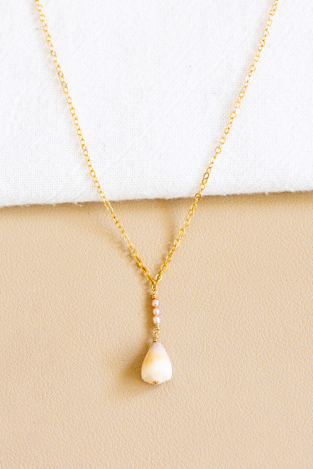 Brown Dwarf Cone & Triple Mini Light Pink Rice Pearl Necklace – Laine ...